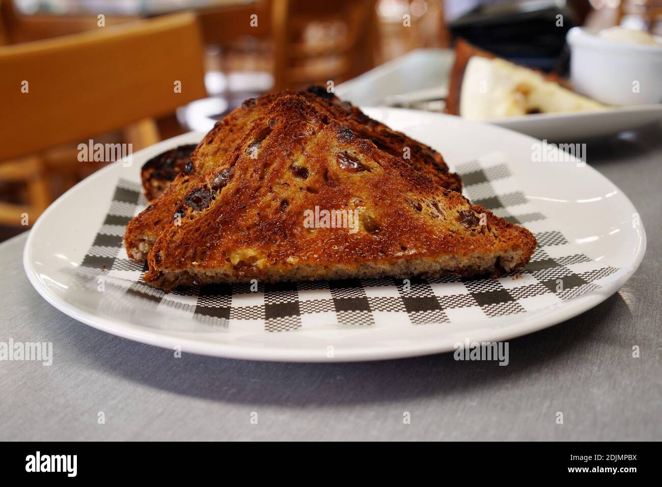 A plate of triangle shaped raisin toast Stock Photo - Alamy