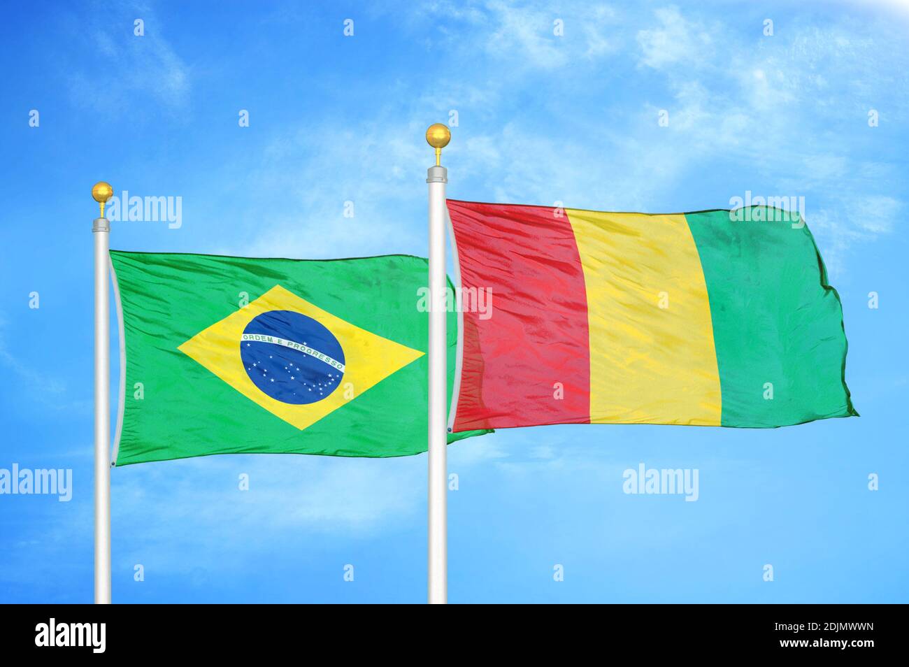 Brazil and Guinea two flags on flagpoles and blue cloudy sky Stock ...
