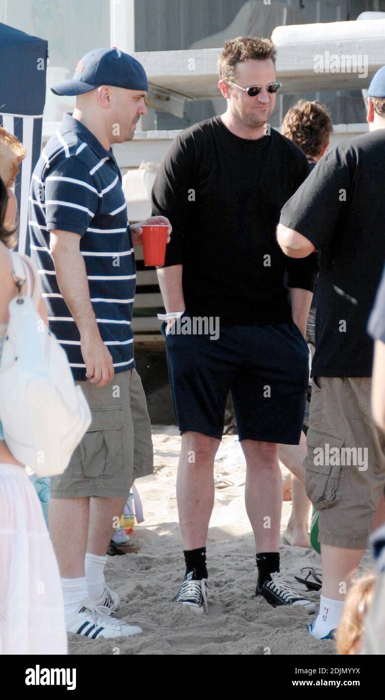 Matthew Perry sticks to water and petting cute puppies at an ...