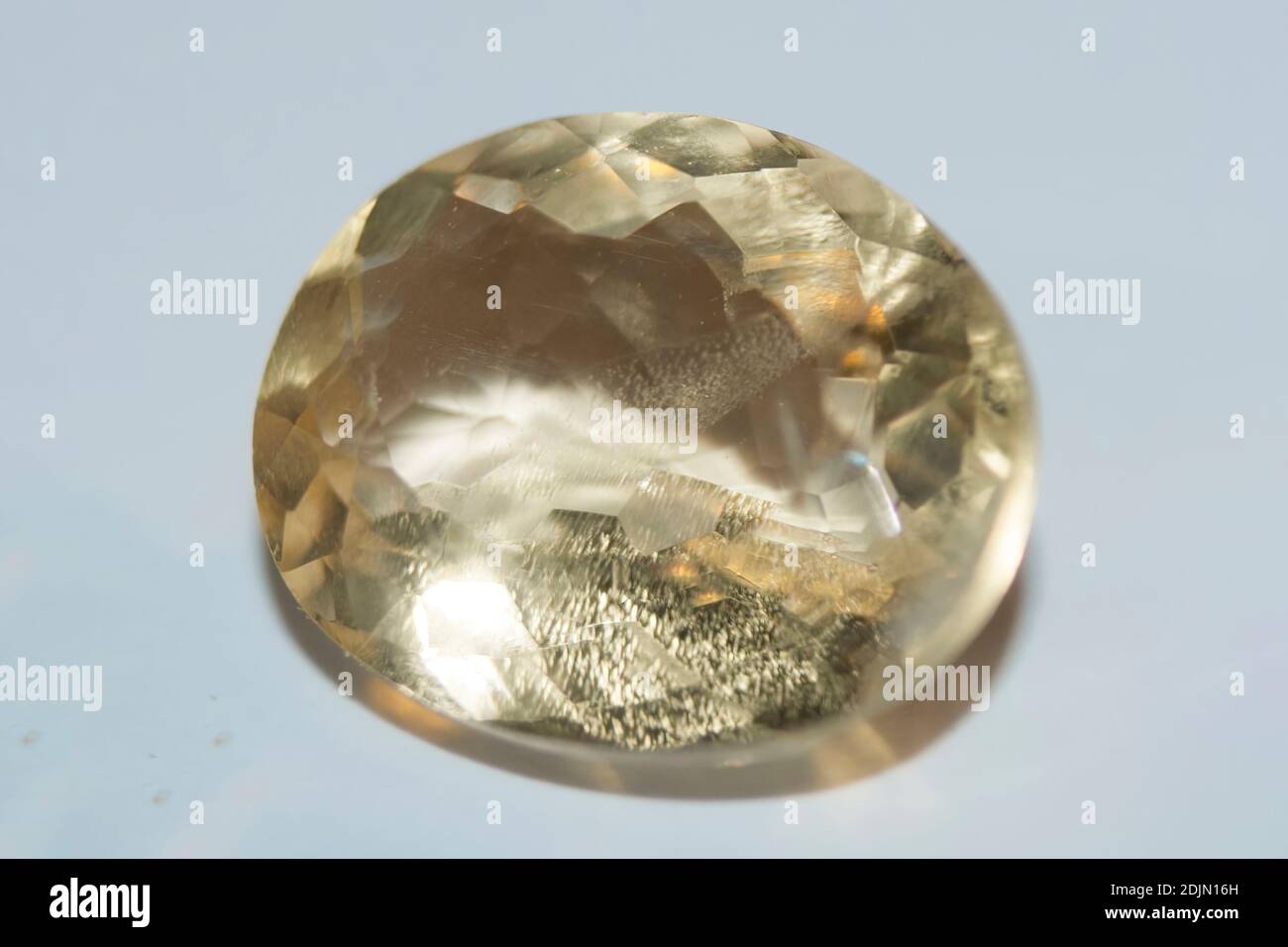 Natural heliodor on a gray background. Natural beryl Stock Photo - Alamy