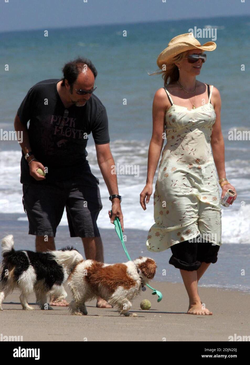 Rosanna Arquette takes a stroll on the beach with a friend while ...