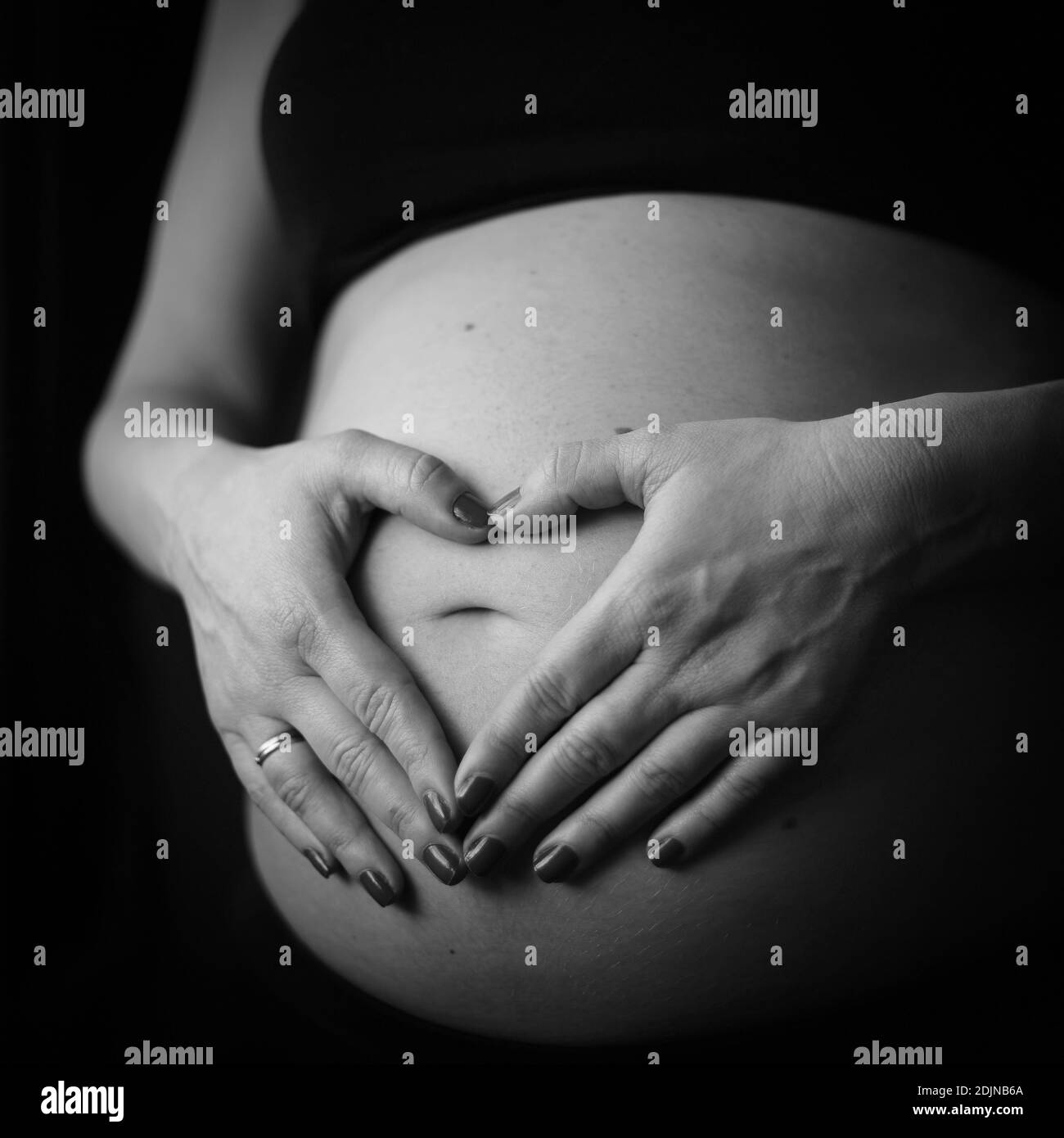 Hands on his stomach Black and White Stock Photos & Images - Alamy