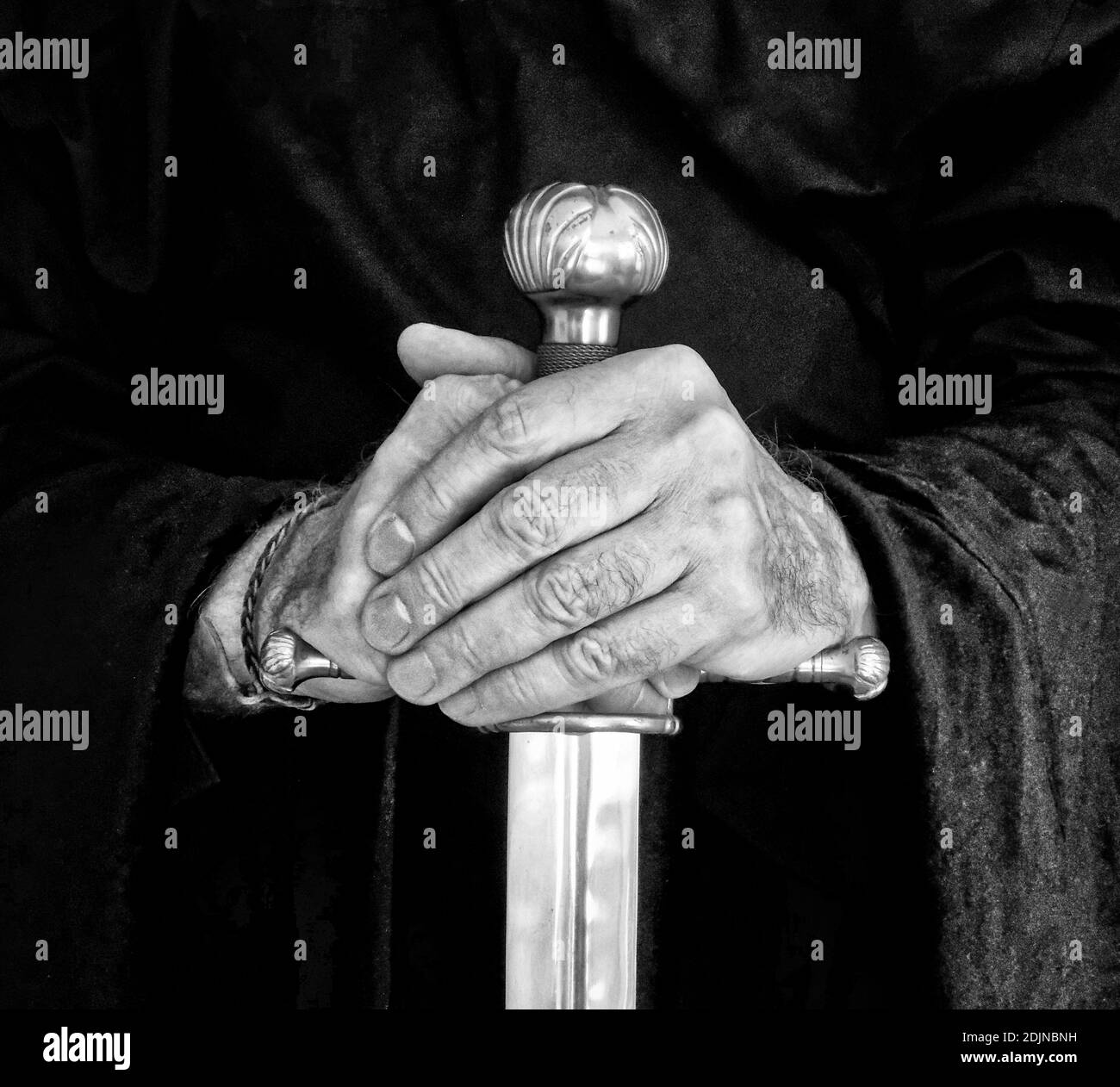 Hand holding sword Black and White Stock Photos & Images - Alamy