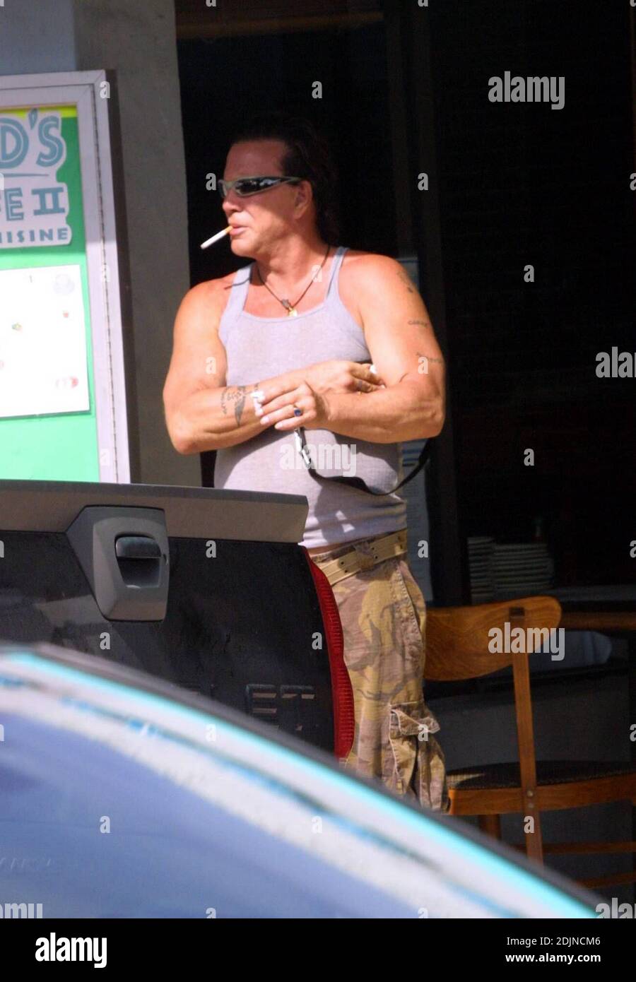 Exclusive!! Mickey Rourke braves the daylight to have a smoke and a ...