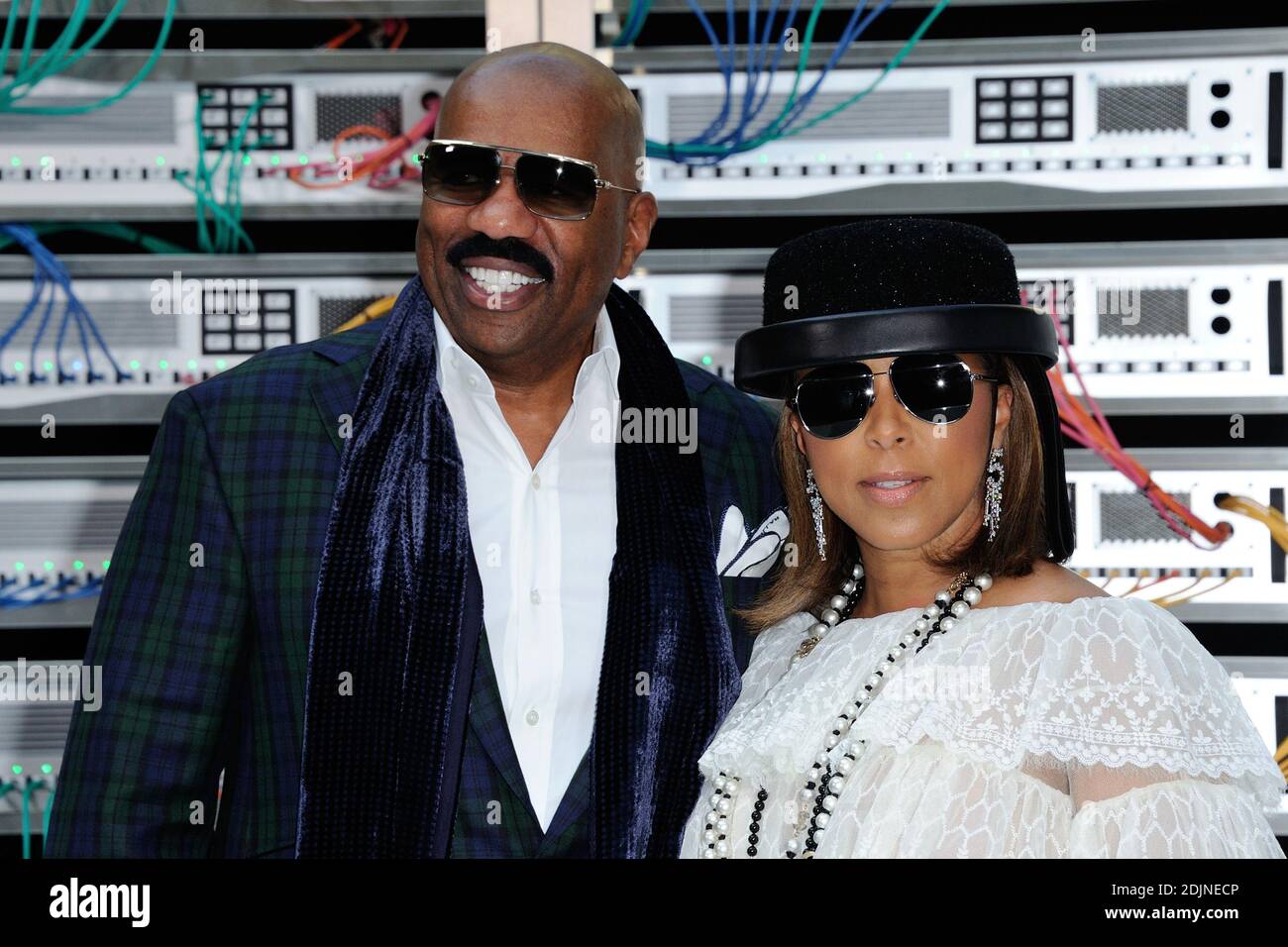 Steve Harvey and Marjorie Harvey attending the Chanel show as a part of ...