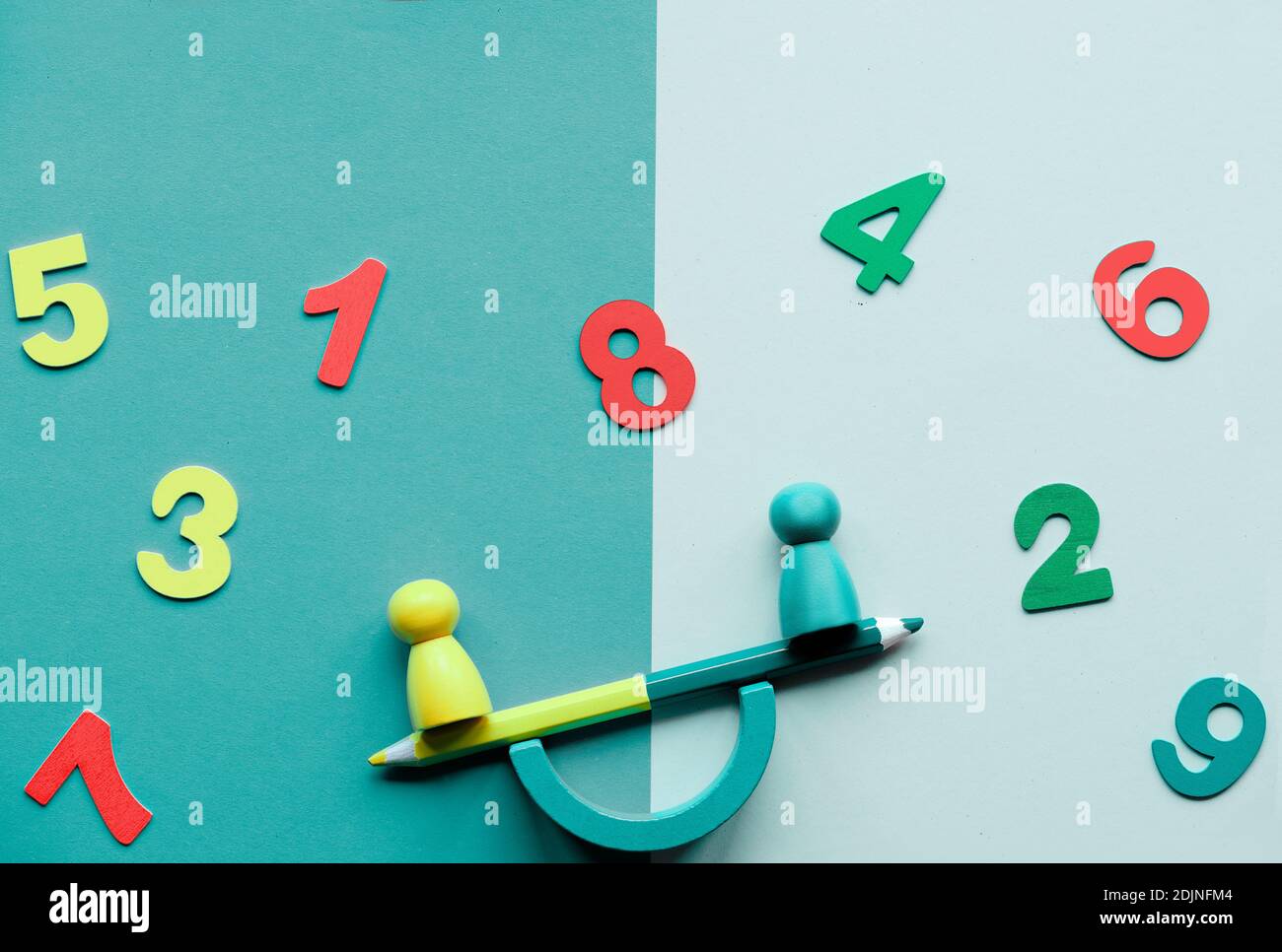 Two figures on a swing, seesaw, on two tone green grey paper. Numbers ...