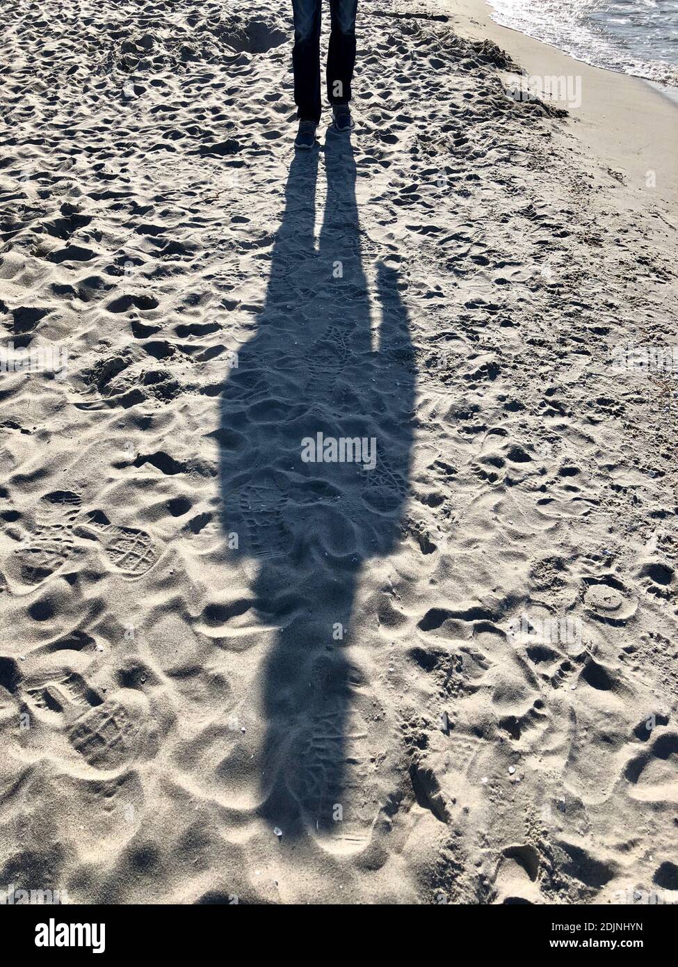 Human shadow on beach hi-res stock photography and images - Alamy