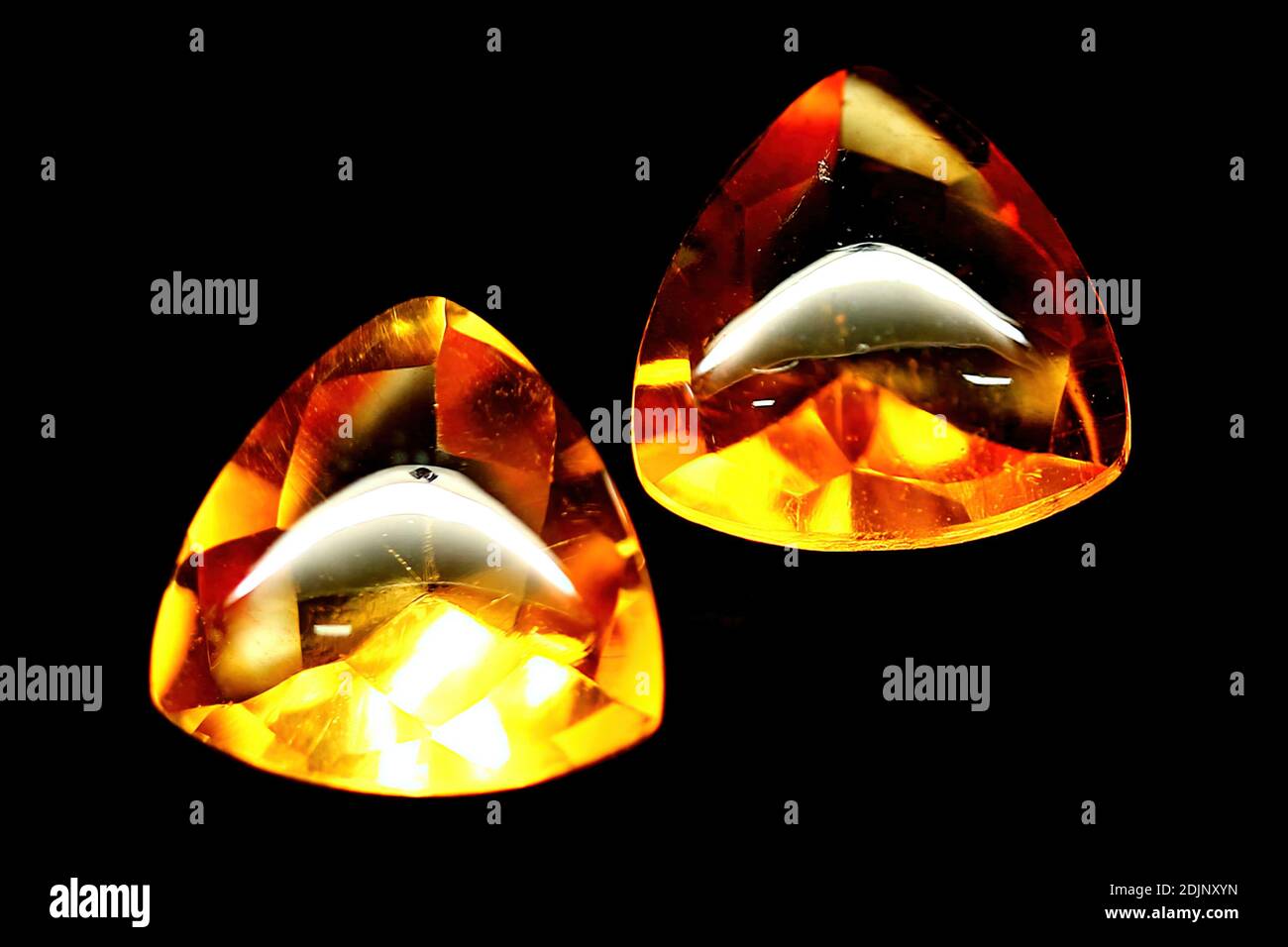 Natural yellow citrine on black background Stock Photo - Alamy