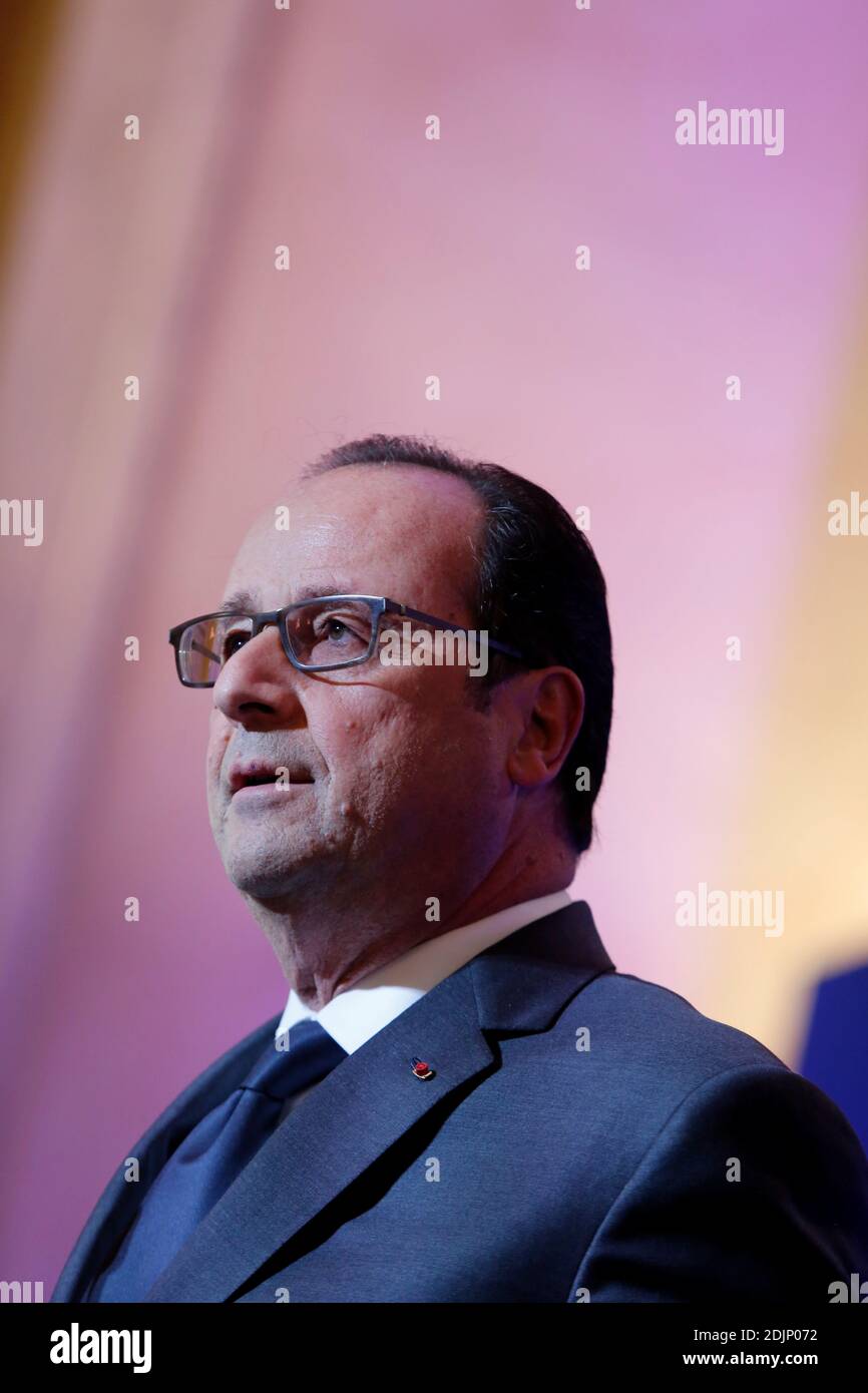 French President Francois Hollande delivers his speech during a ...