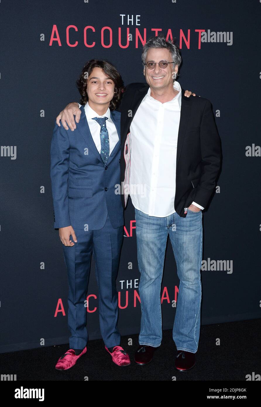 Rio Mangini and Mark Mangini attend the premiere of The Accountant in ...