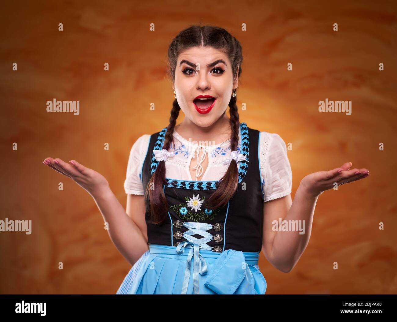 Young woman in German popular costume in closeup, studio shot Stock ...