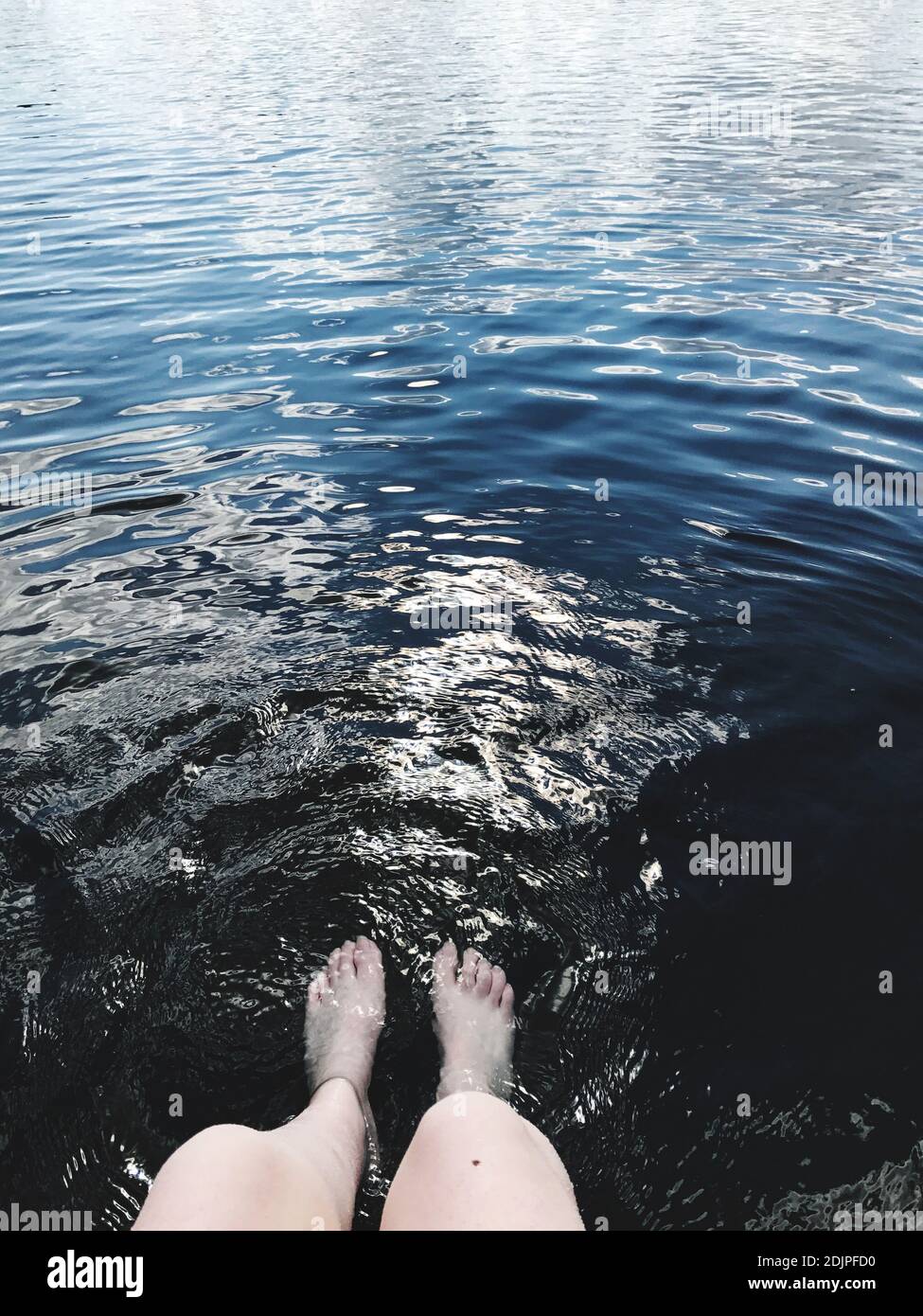 Women dangling legs hi-res stock photography and images - Alamy