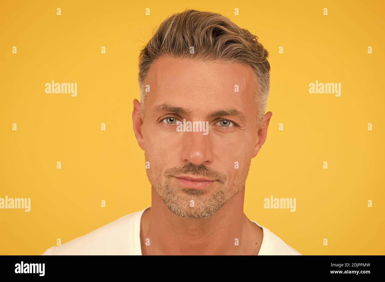 Skincare is essential. Handsome man yellow background. Caucasian guy ...