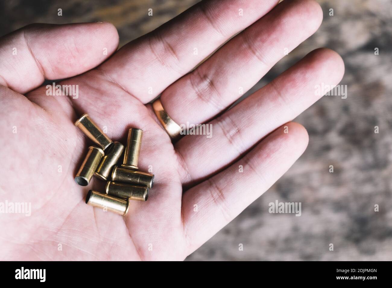 Hand holding bullets cartridge bullet hi-res stock photography and ...