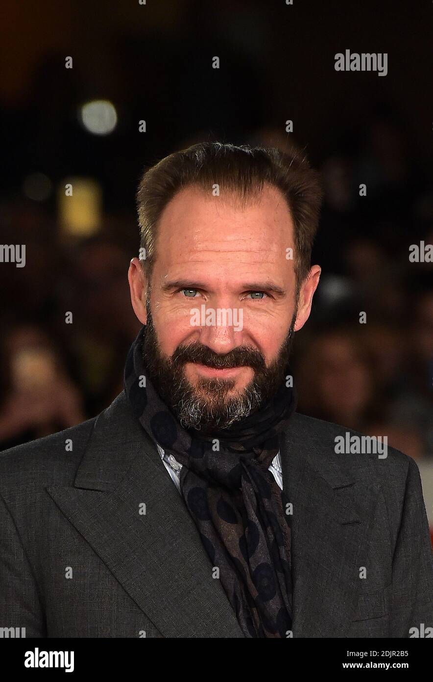 British actor Ralph Fiennes poses on the red carpet as she arrives for ...