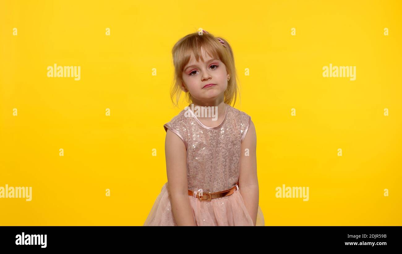 Bored tired lazy child looking at camera with indifference, shocked and ...