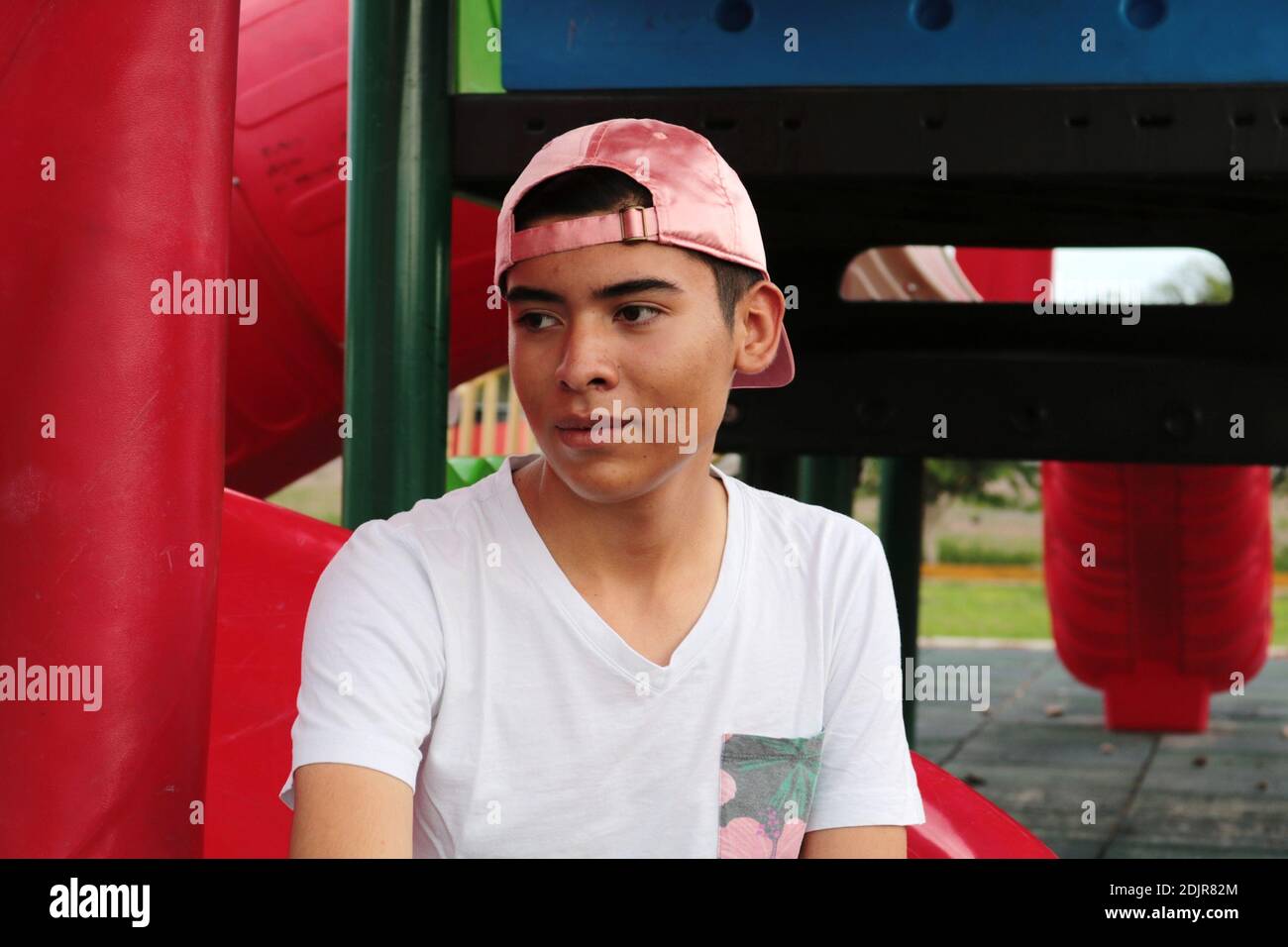 Playground slide man sitting hi-res stock photography and images - Alamy