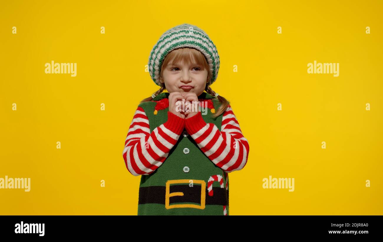 Sly kid teen girl steepls fingers and schemes something gets ...