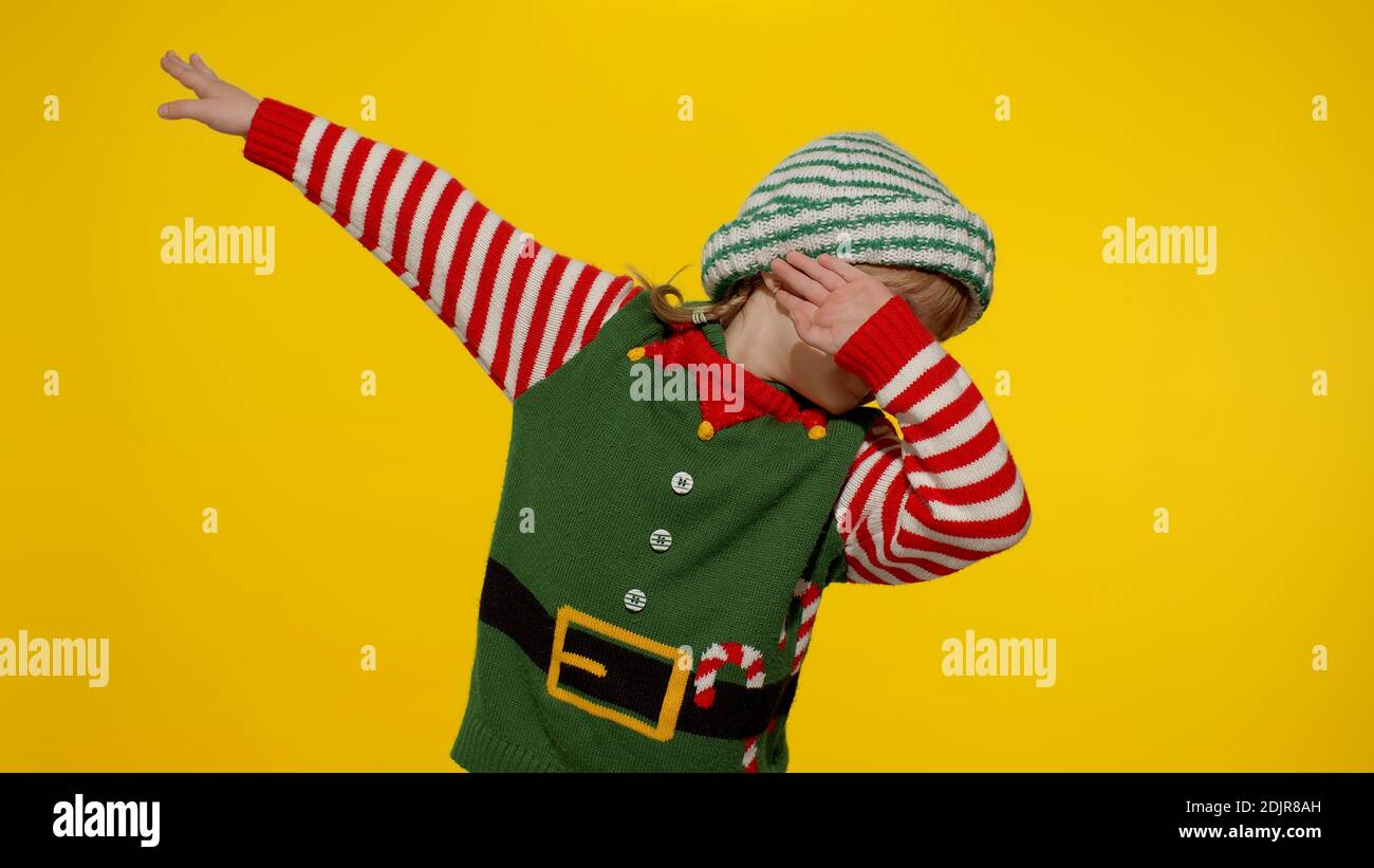 Little fun blonde kid teen teenager girl in Christmas elf Santa helper ...