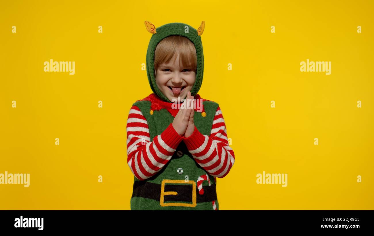 Sly kid teen showing tongue and schemes something gets interesting idea ...