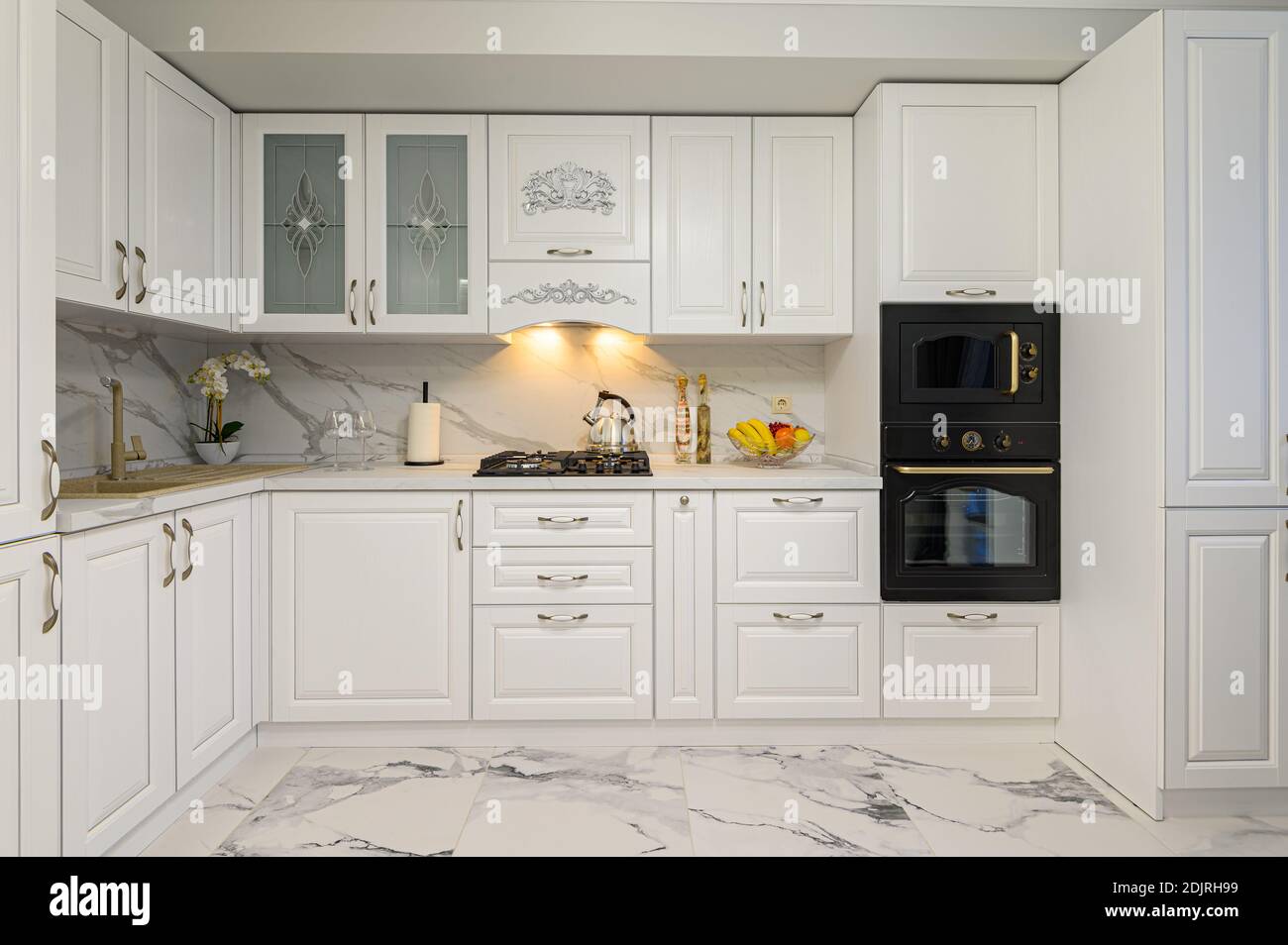 White kitchen in classic style, front view Stock Photo - Alamy