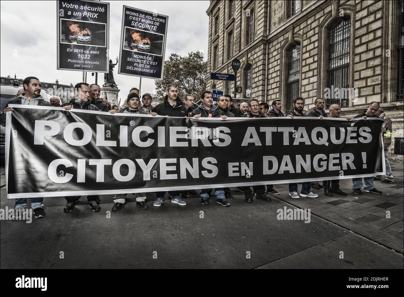 Police officers and supporters take part in a rally to protest over ...