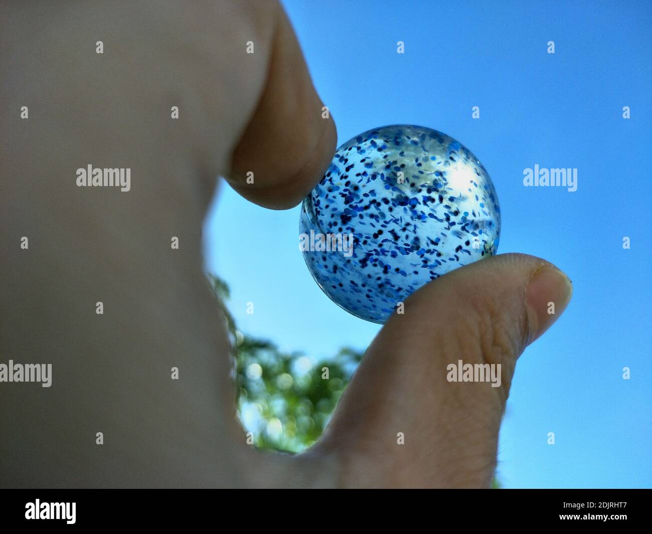 Hand Holding Marbles High Resolution Stock Photography and Images - Alamy