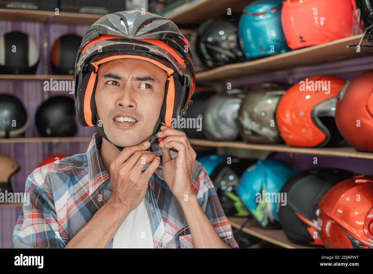 People wearing helmets on motorbike hi-res stock photography and images ...