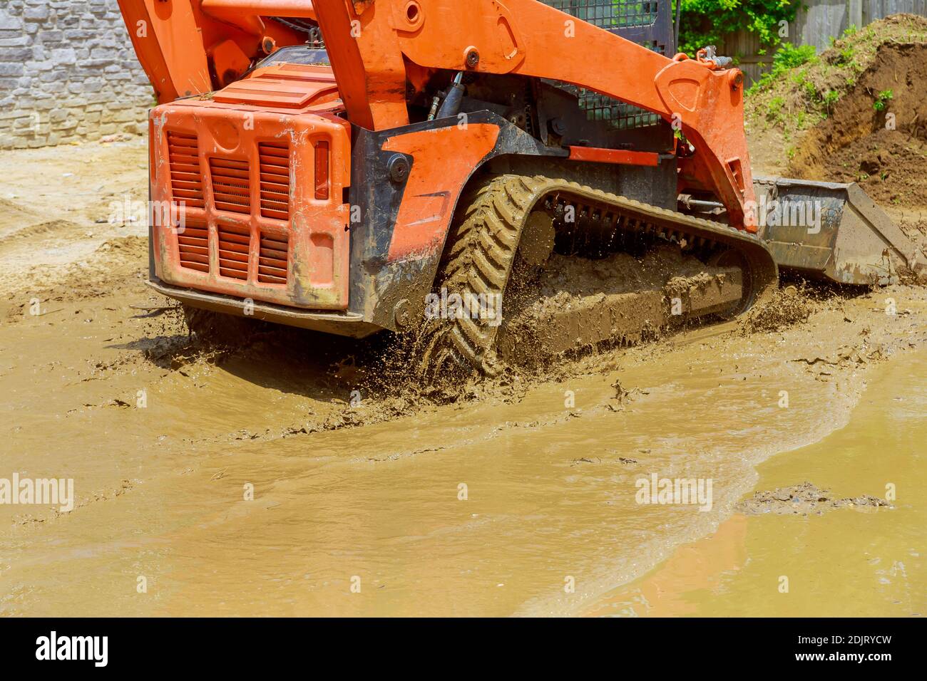 Excavator digging soil during pushes during pushes soil a ground ...