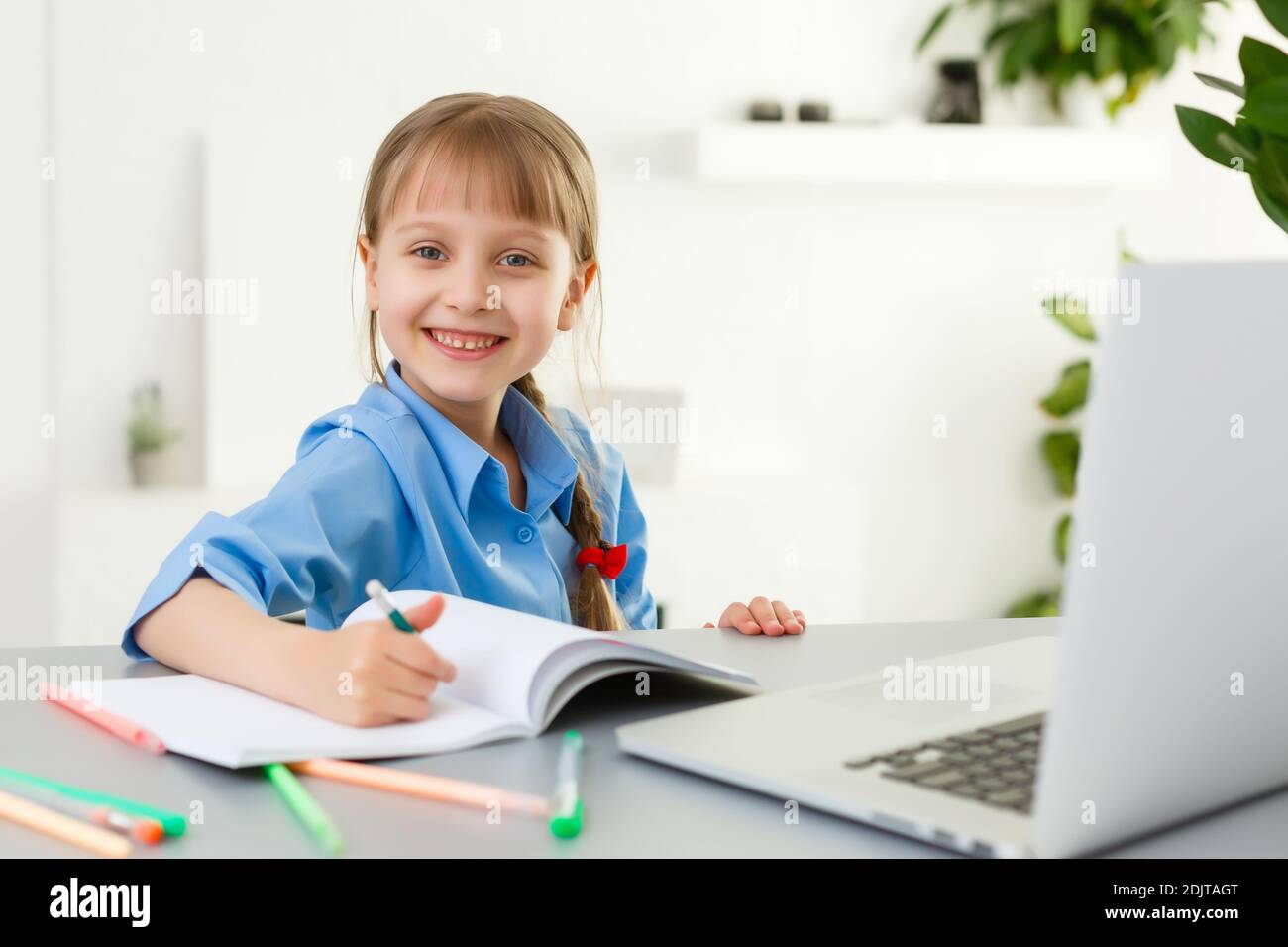 Remote lessons. The child smiles happily and gets knowledge remotely ...