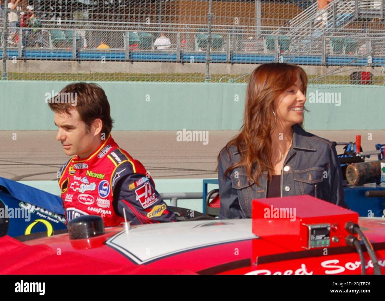 Race car driver Jeff Gordon and wife at the Ford 400 NASCAR NEXTEL Cup ...