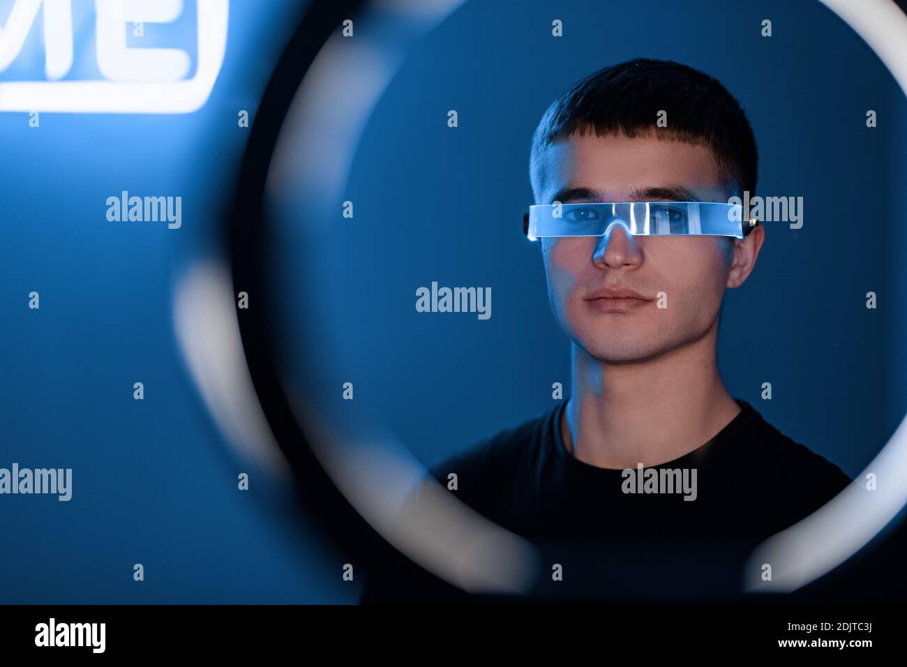 Face young man glowing light hi-res stock photography and images - Alamy