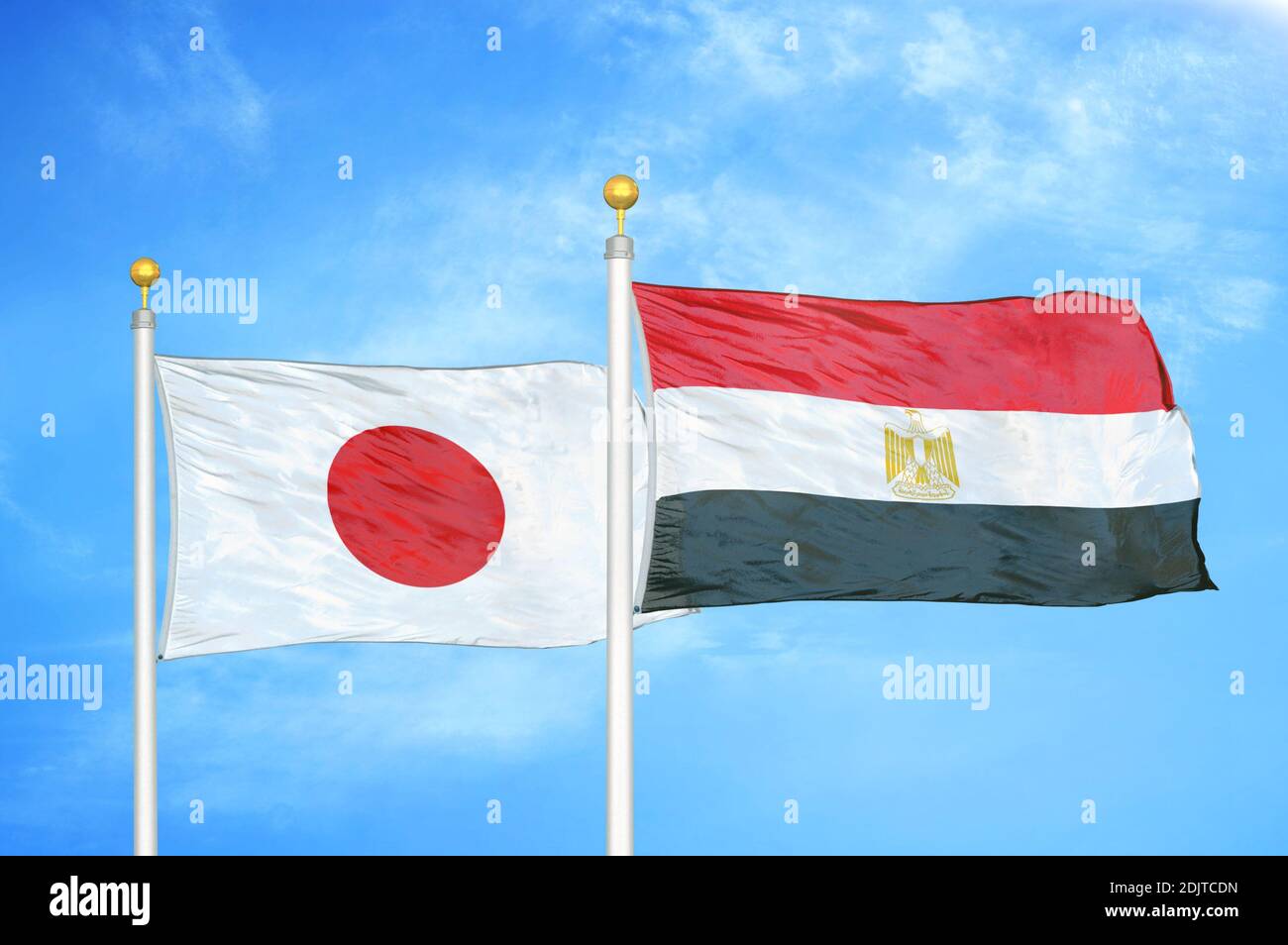 Japan and Egypt two flags on flagpoles and blue cloudy sky Stock Photo ...