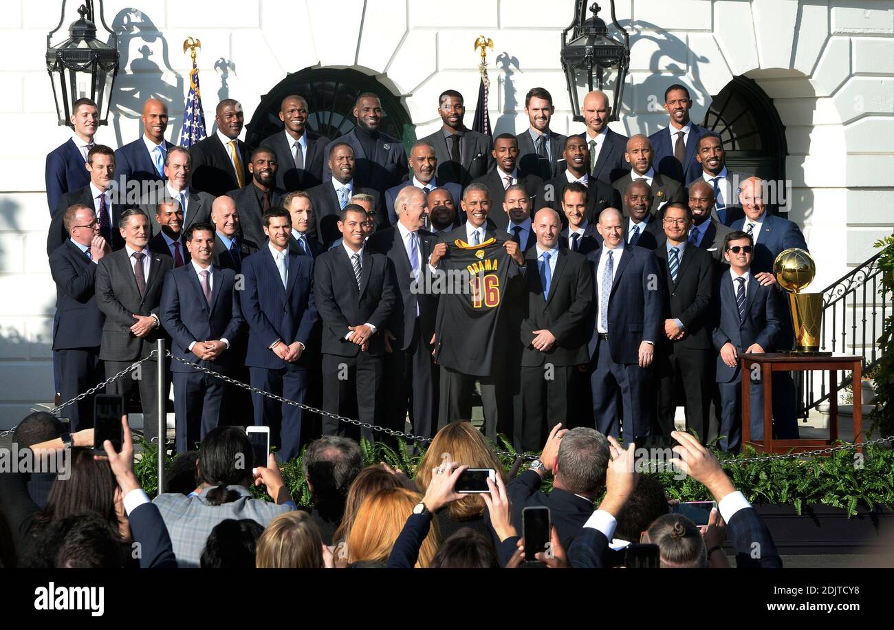 U.S. President Barack Obama poses with the Cleveland Cavaliers during ...