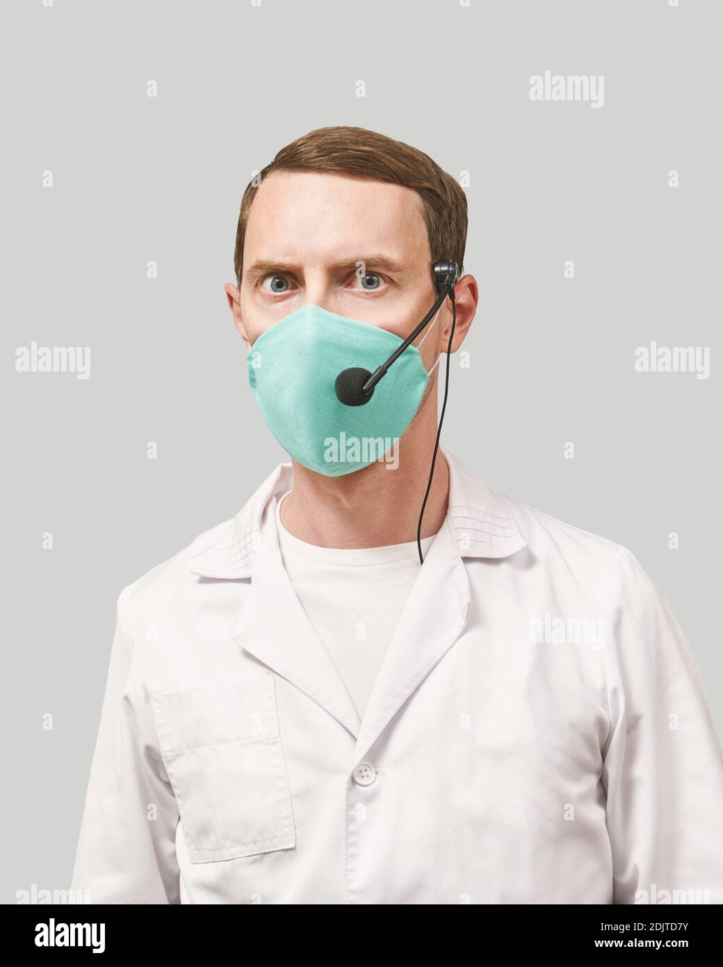 Male doctor with headphones. Studio Medicine portrait Stock Photo - Alamy