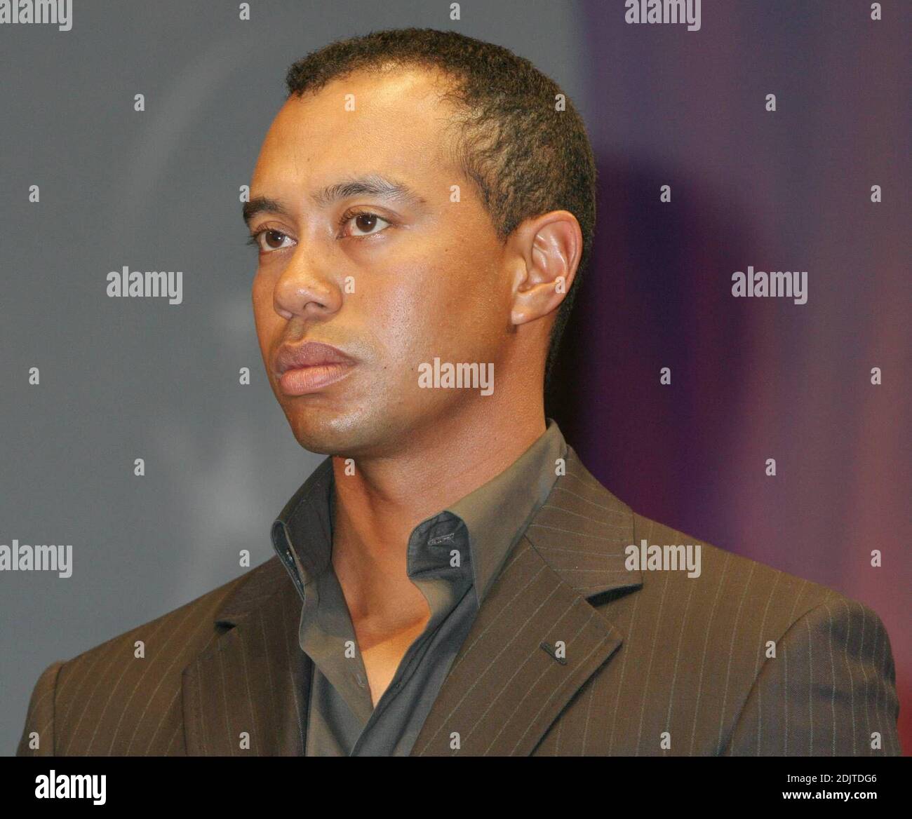 Golfer Tiger Woods arrives at the unveiling of the new 2008 Buick ...