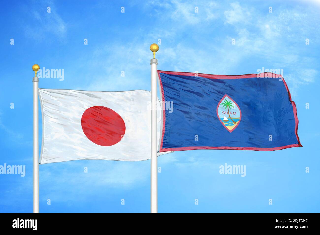 Japan and Guam two flags on flagpoles and blue cloudy sky Stock Photo ...
