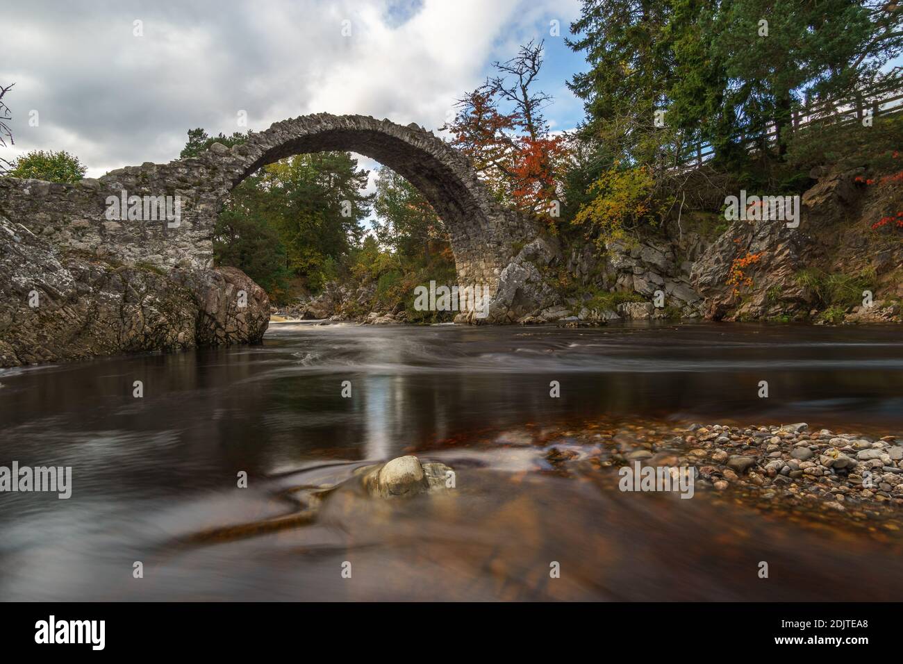 old stone bridge over red river in scotland at autumn Stock Photo - Alamy