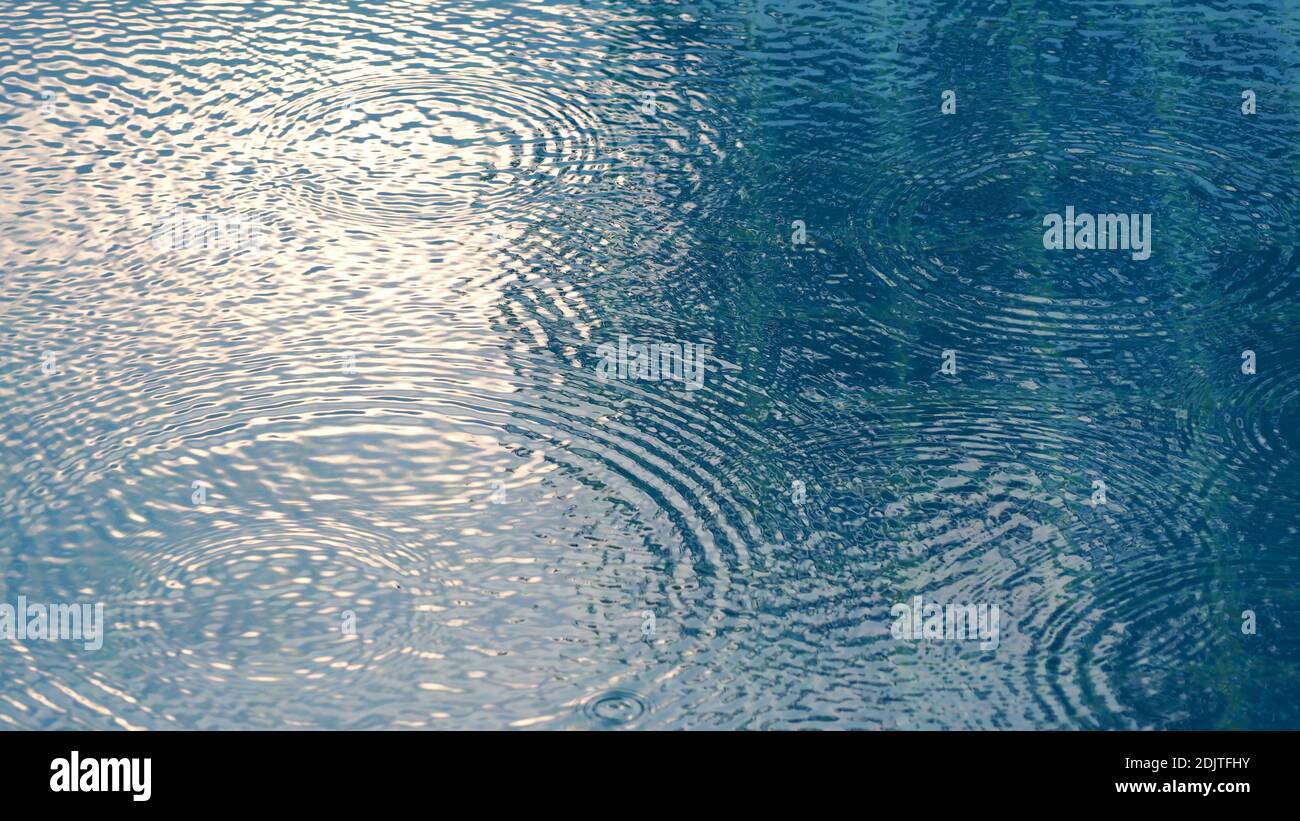 Rain falling on swimming pool hi-res stock photography and images - Alamy