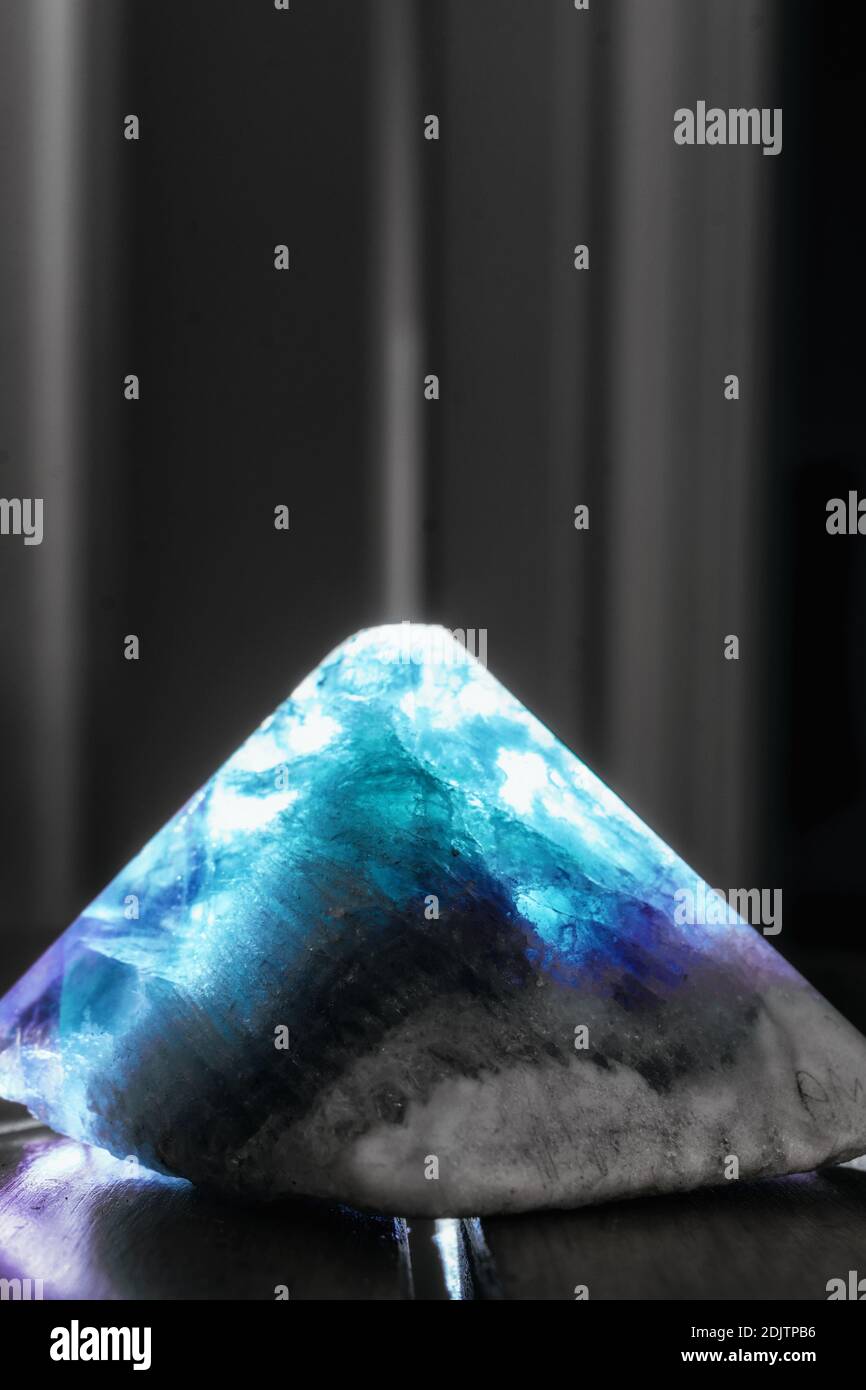 a small glowing christal pyramid Stock Photo - Alamy