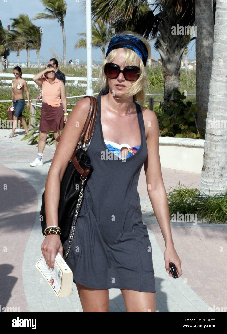 Kim Stewart wears Uggs to the beach but while sunbathing reveals she is ...