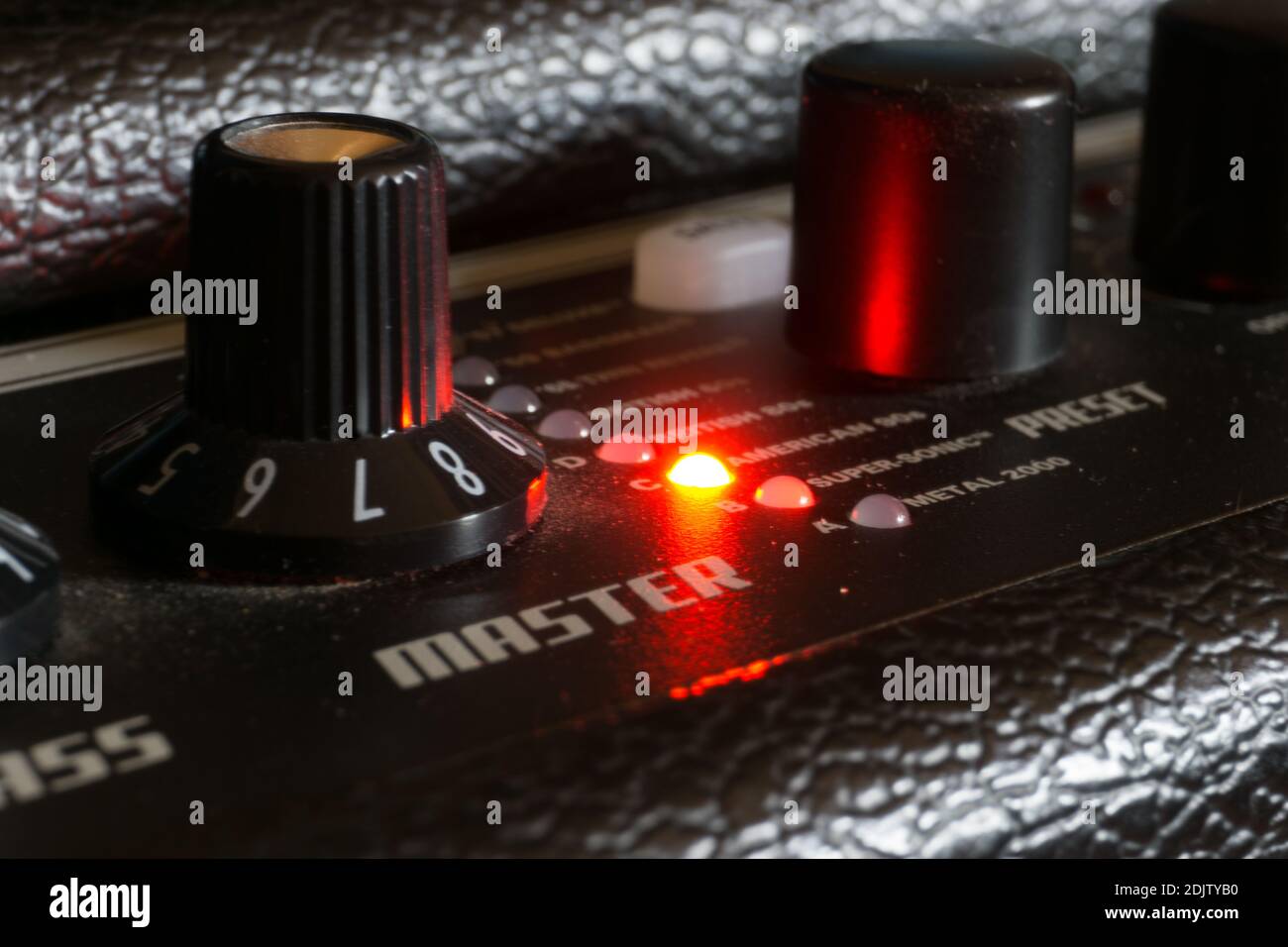 Detail of an amplifier for electric guitar with red lights Stock Photo ...