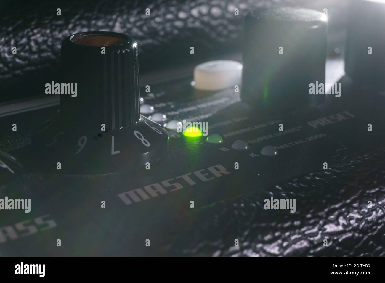 Detail of an amplifier for electric guitar with green lights Stock ...