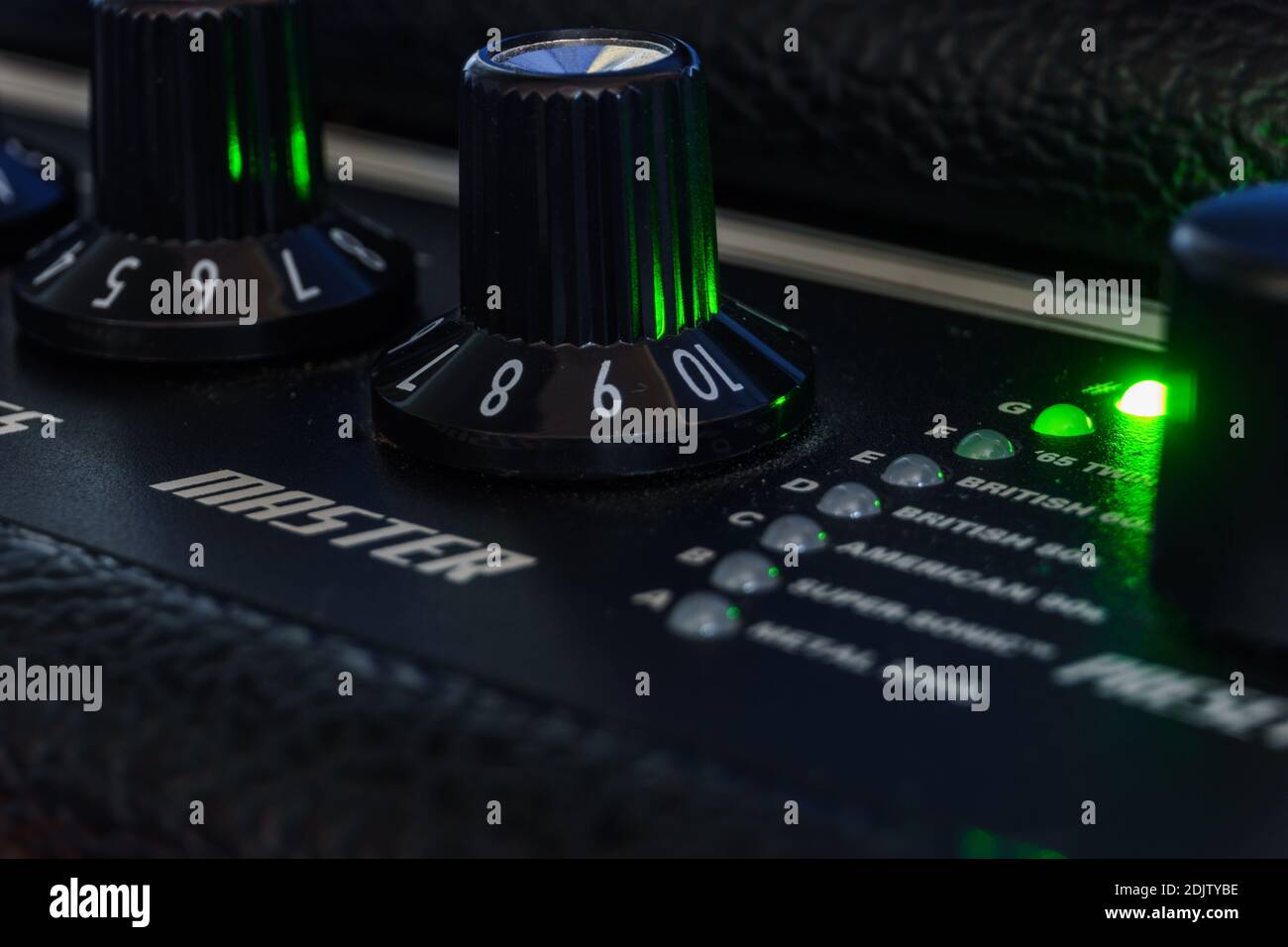 Detail of an amplifier for electric guitar with green lights Stock ...