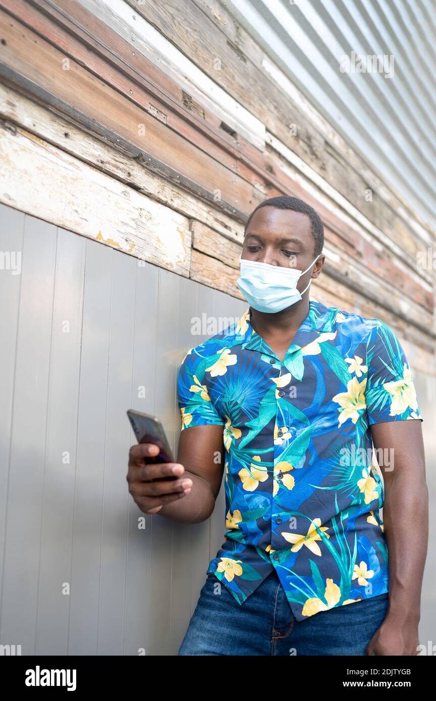 A young black man with a mask in the covid-19 pandemic season Stock ...