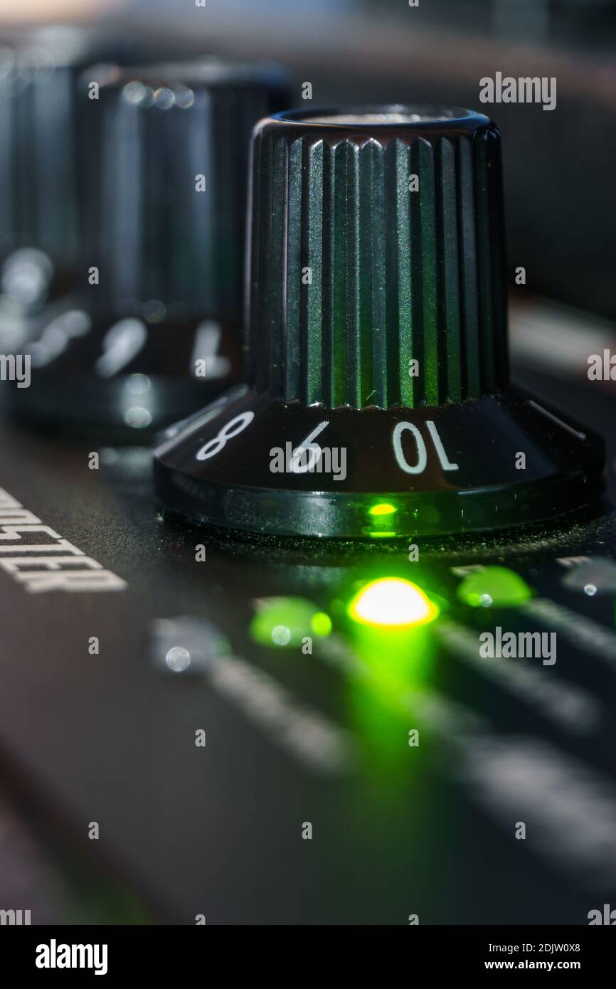 Detail of an amplifier for electric guitar with green lights Stock ...