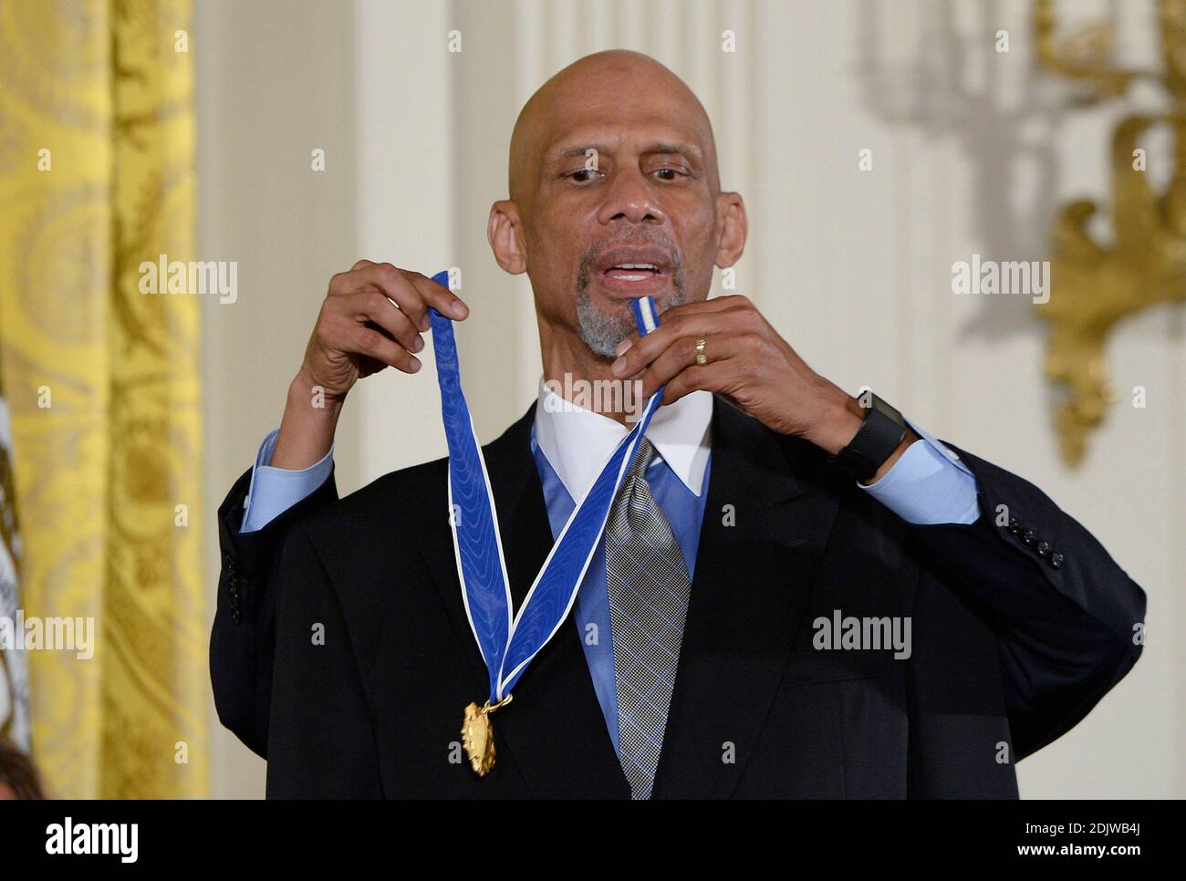 US President Barack Obama presents Kareem Abdul-Jabbar with the Presidential Medal of Freedom ...