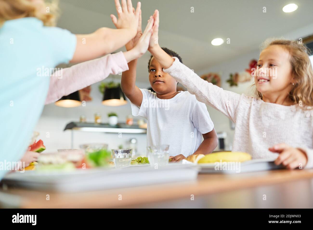 Boys high fiving hi-res stock photography and images - Alamy
