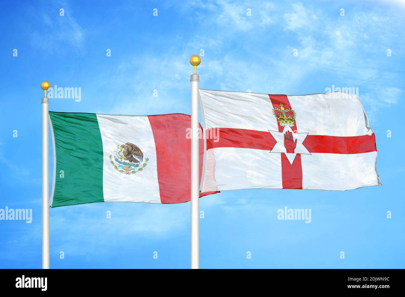 Mexico and Northern Ireland two flags on flagpoles and blue cloudy sky ...