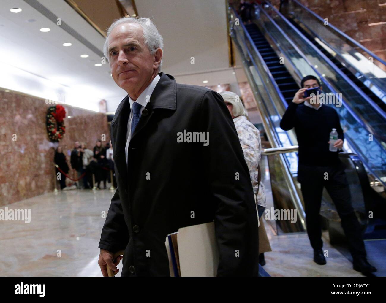 Senator from Tennessee Bob Corker walks through the lobby of Trump ...